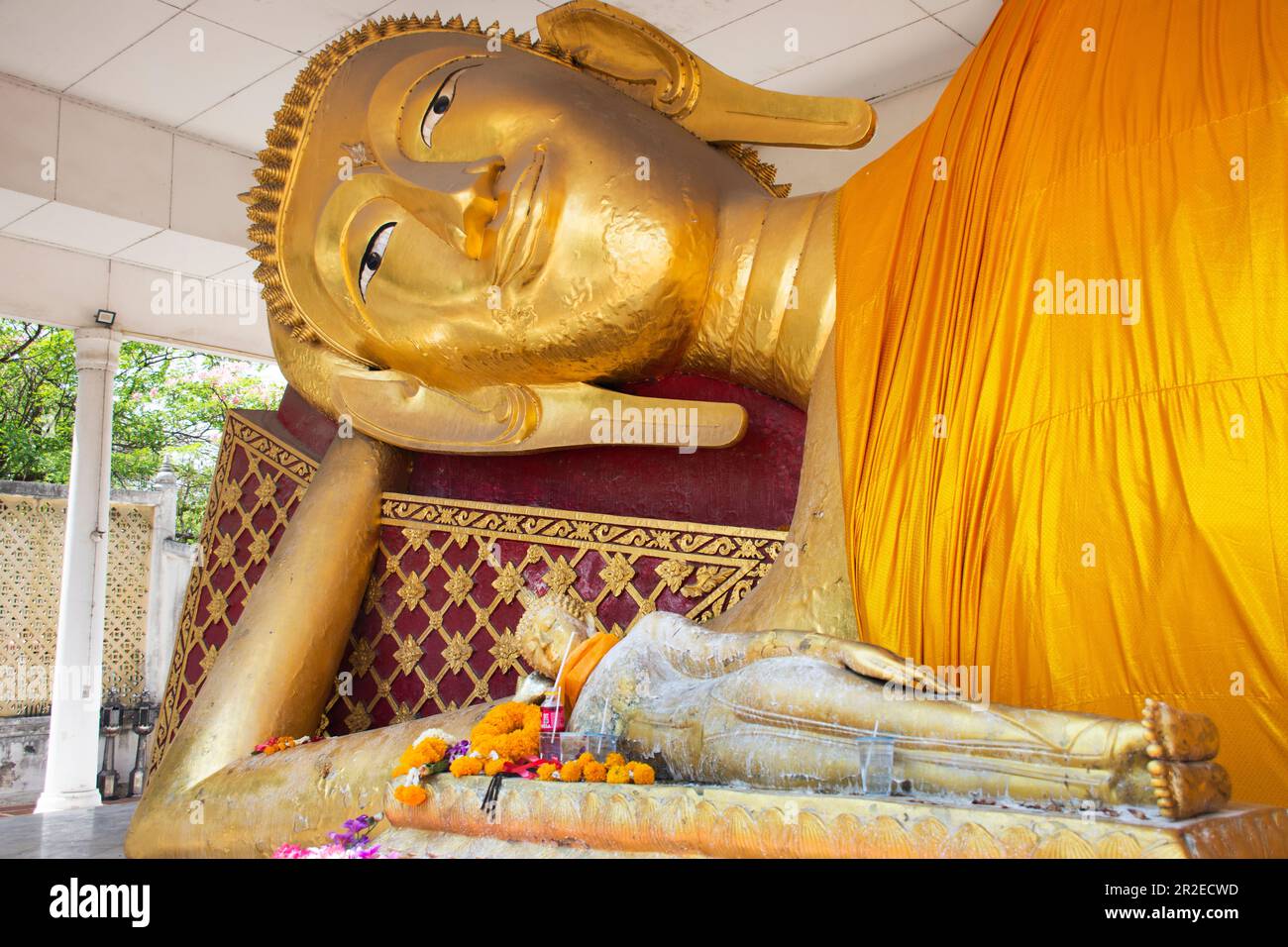 Buddha reclining attitude statue of Wat Ku or Phra Nang Rua Lom temple ...