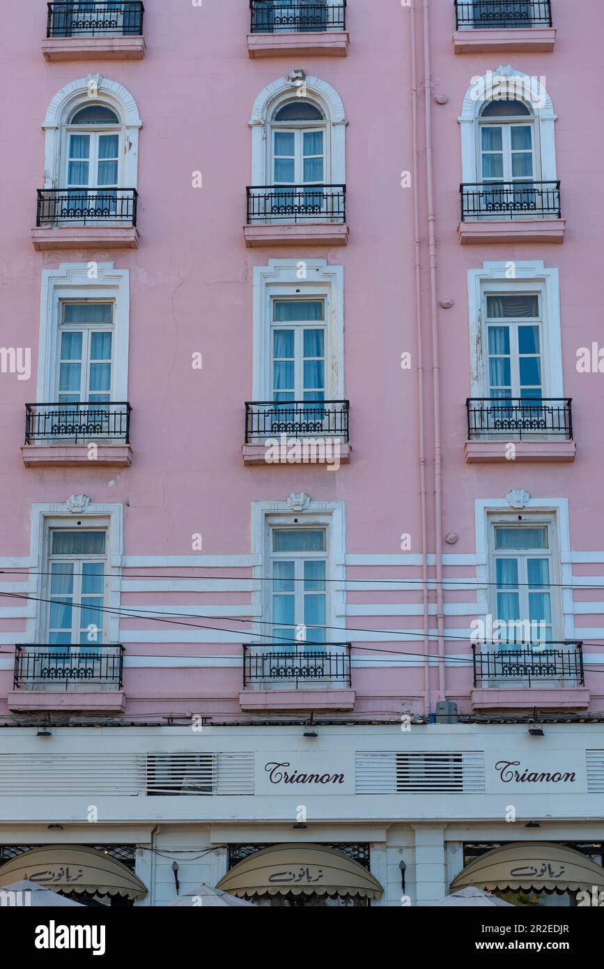 The pink facade of Le Metropole Hotel and famous once Greek cafe and ...