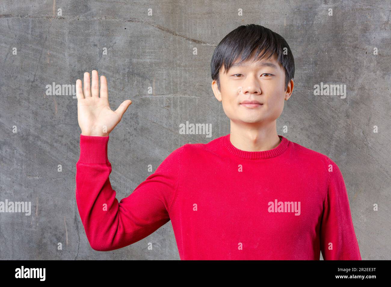 portrait of young asian man pointing Stock Photo - Alamy
