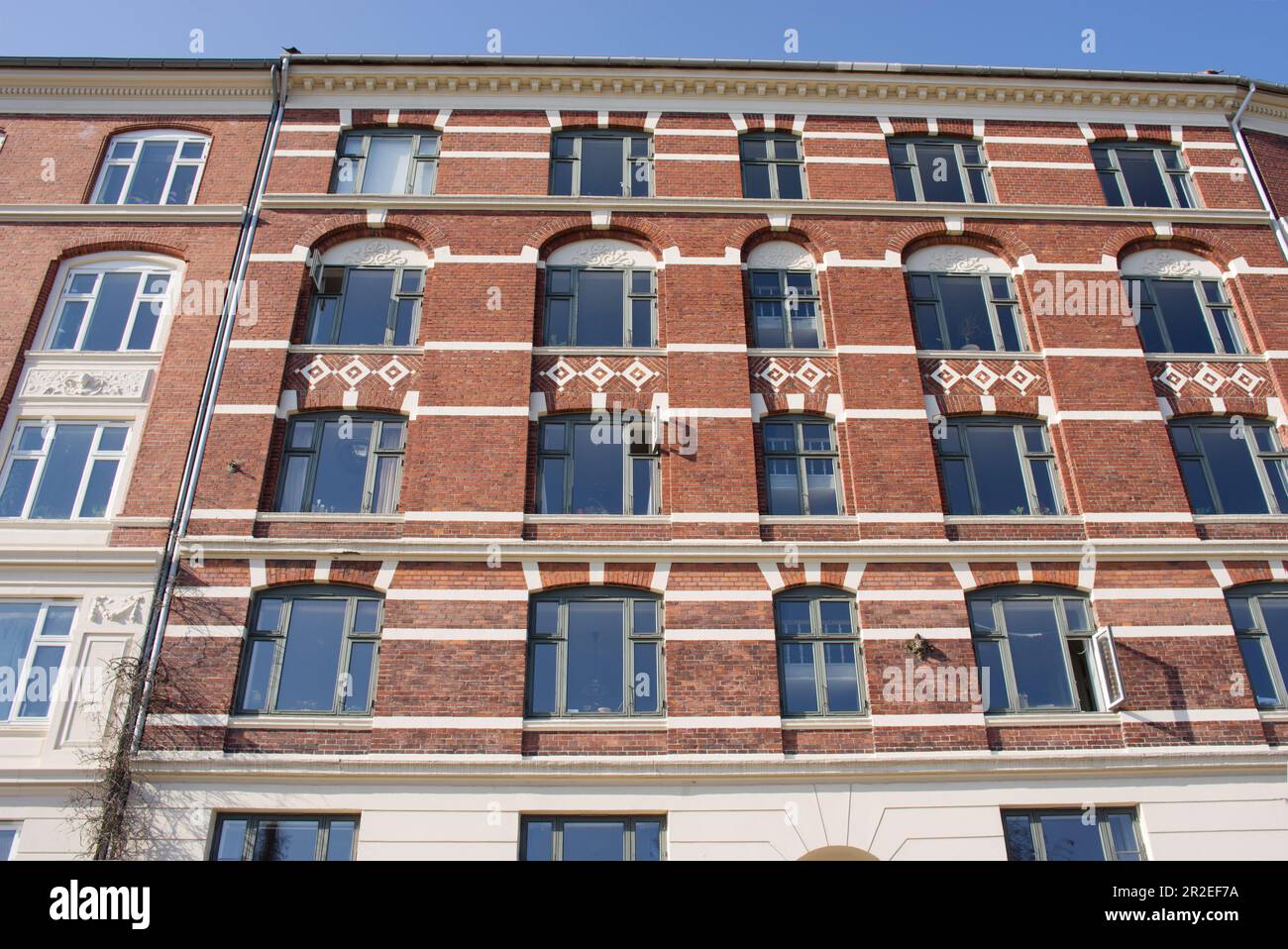 Facade of a apartment building iwith windows the center of Copenhagen ...