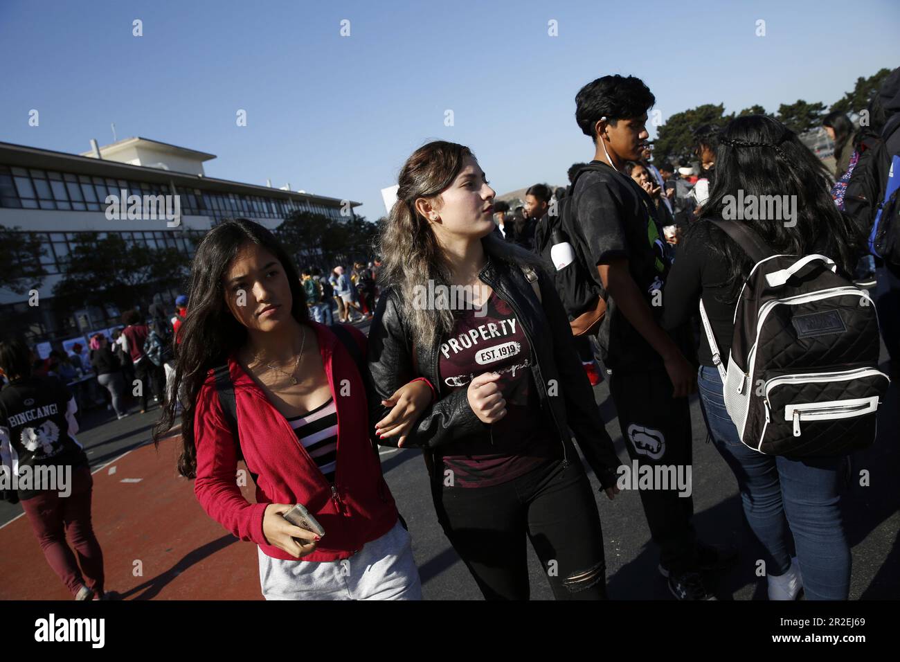 Melissa Hernandez Rivera walks arm in arm with friend Carol Perez as ...
