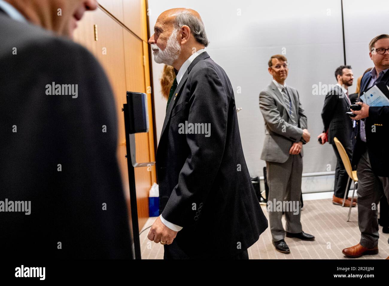 Former Federal Reserve Chairman Ben Bernanke, center, departs after ...