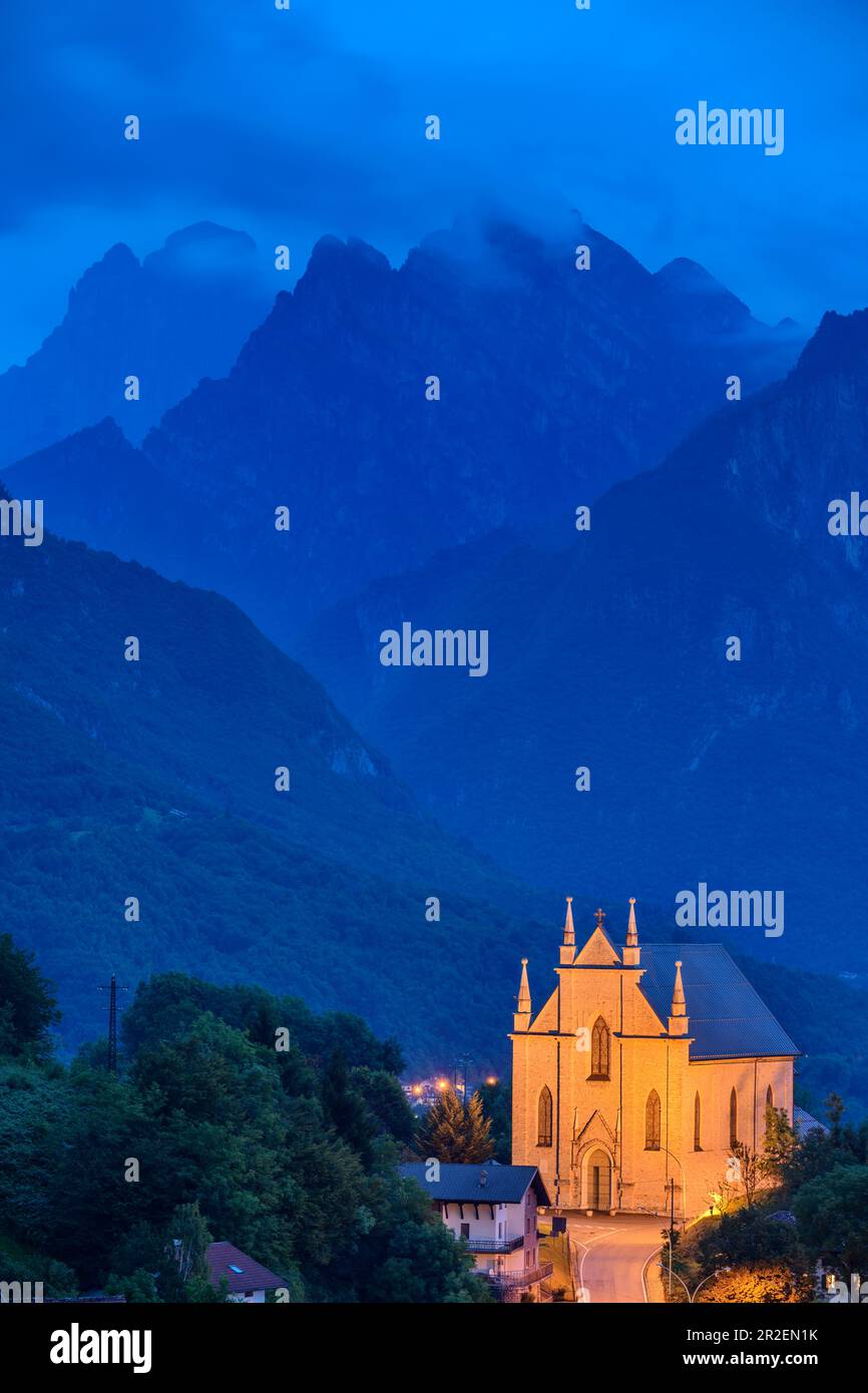 Illuminated church from Sospirolo over Belluno Dolomites, Sospirolo ...