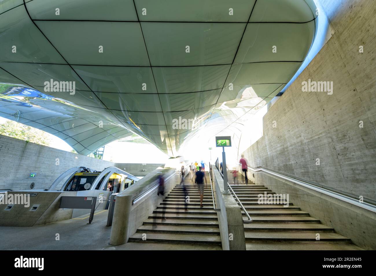 Several people leave the Hungerburg mountain station, architect Zaha ...