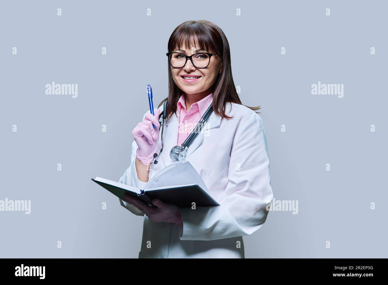Female doctor taking patient notes hi-res stock photography and images ...