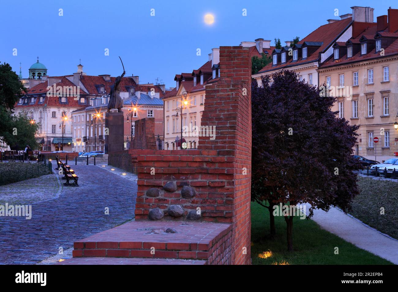Medieval fortified city walls located along Podwale Street, evening ...