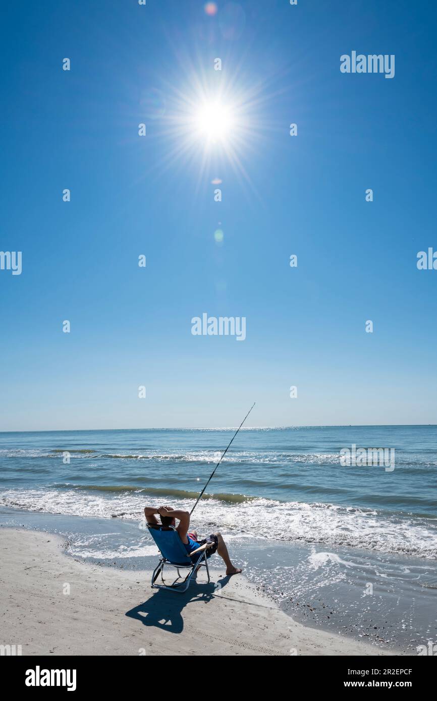 Relaxed beach fishing on the Gulf of Mexico, Fort Myers Beach, Florida ...