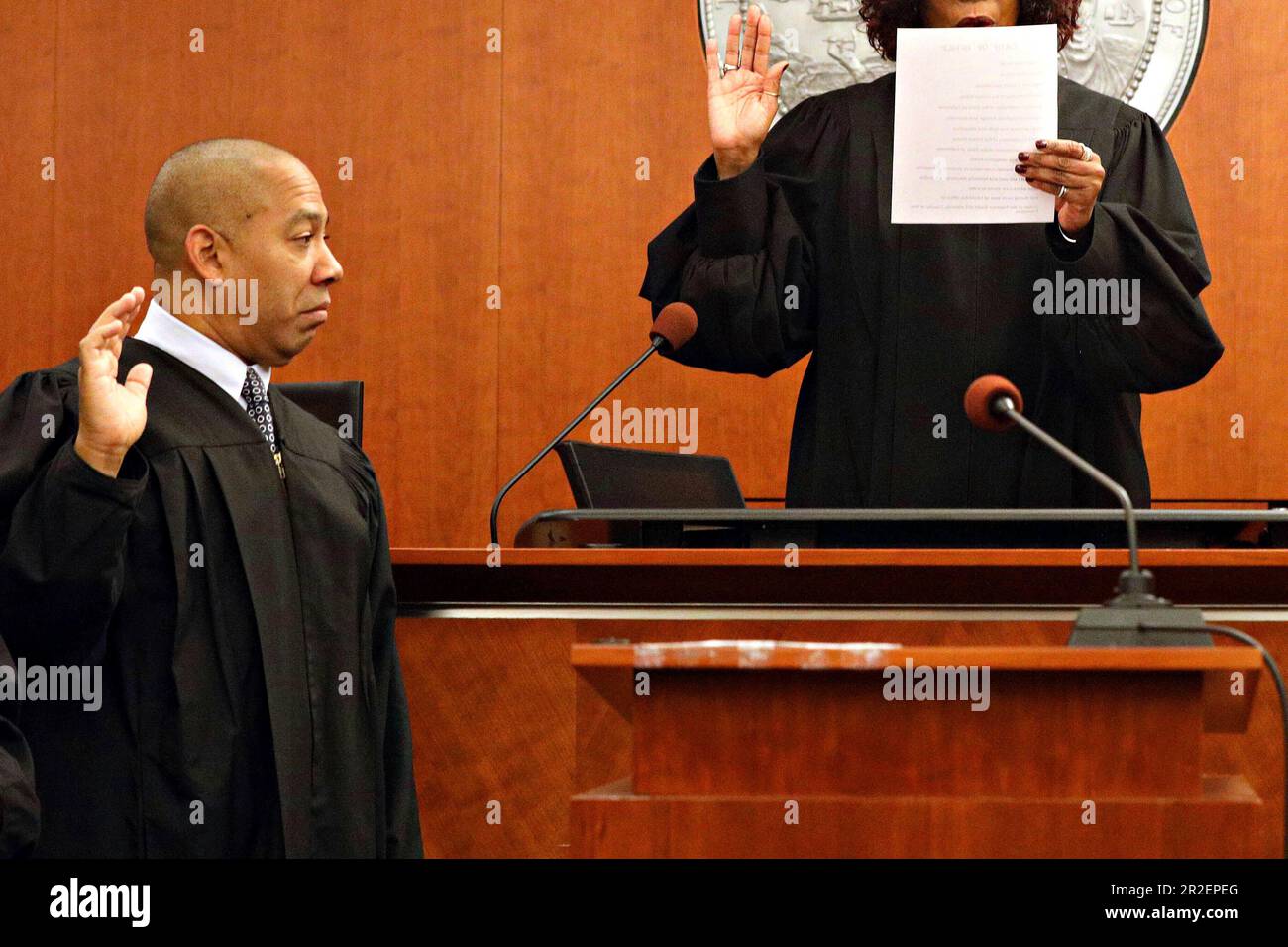 Christopher C. Hite (left) and Hon. Samuel Feng (right) are sworn in by ...
