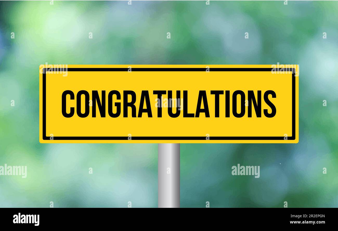 Congratulations road sign on blur background Stock Photo - Alamy