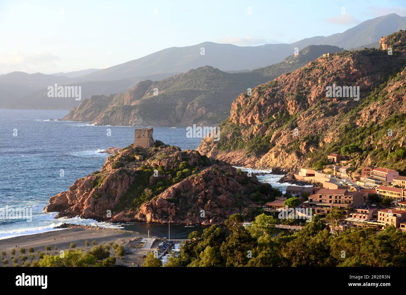Porto with medieval tower and beach on the Gulf of Porto, western ...