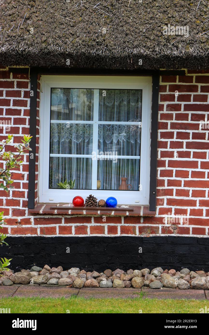 Traditional window in a brick wall building with thatched roof Stock ...