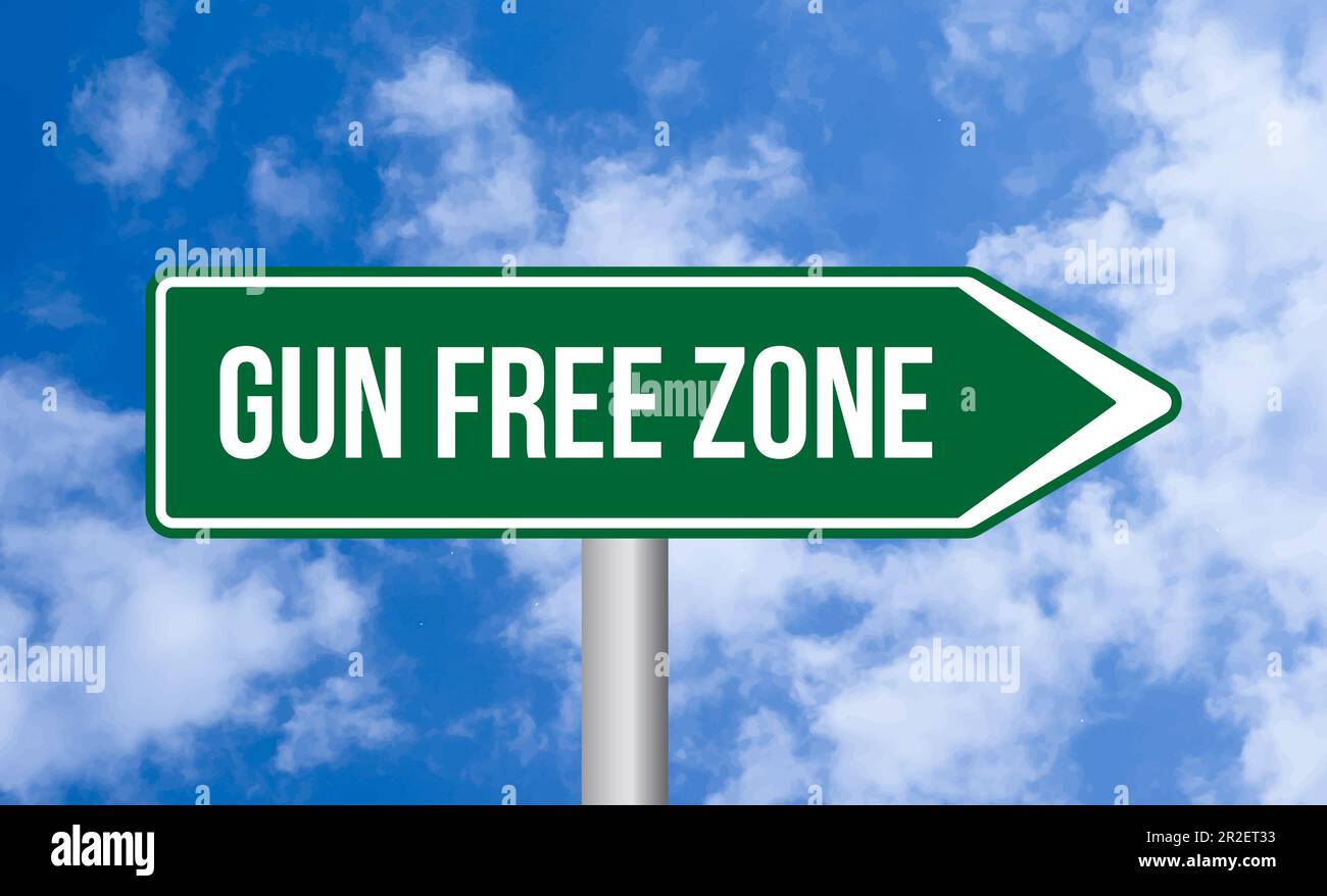 Gun free zone road sign on sky background Stock Photo - Alamy
