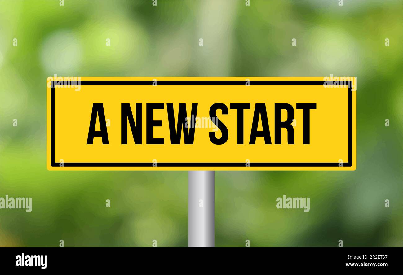 A new start road sign on blur background Stock Photo - Alamy