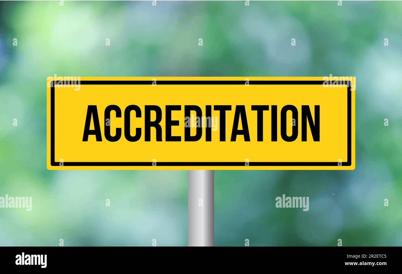 Accreditation road sign on blur background Stock Photo - Alamy