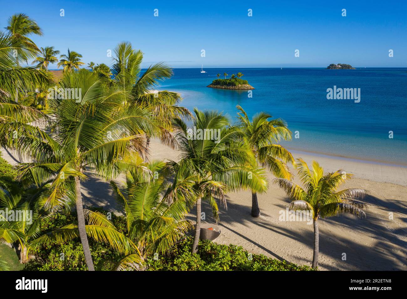 Aerial of coconut trees and beach at Six Senses Fiji Resort, Malolo ...