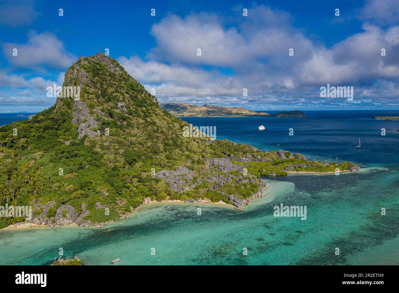 Aerial of Sawa-i-Lau Mountain with cruise ship MV Reef Endeavour ...