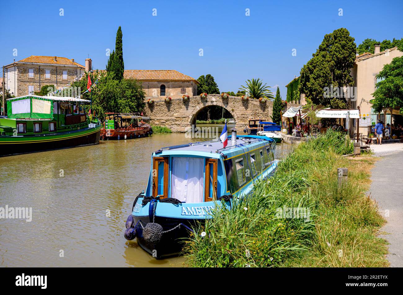 Boats in Le Somail on the Canal du Midi, Occitania, France Stock Photo ...