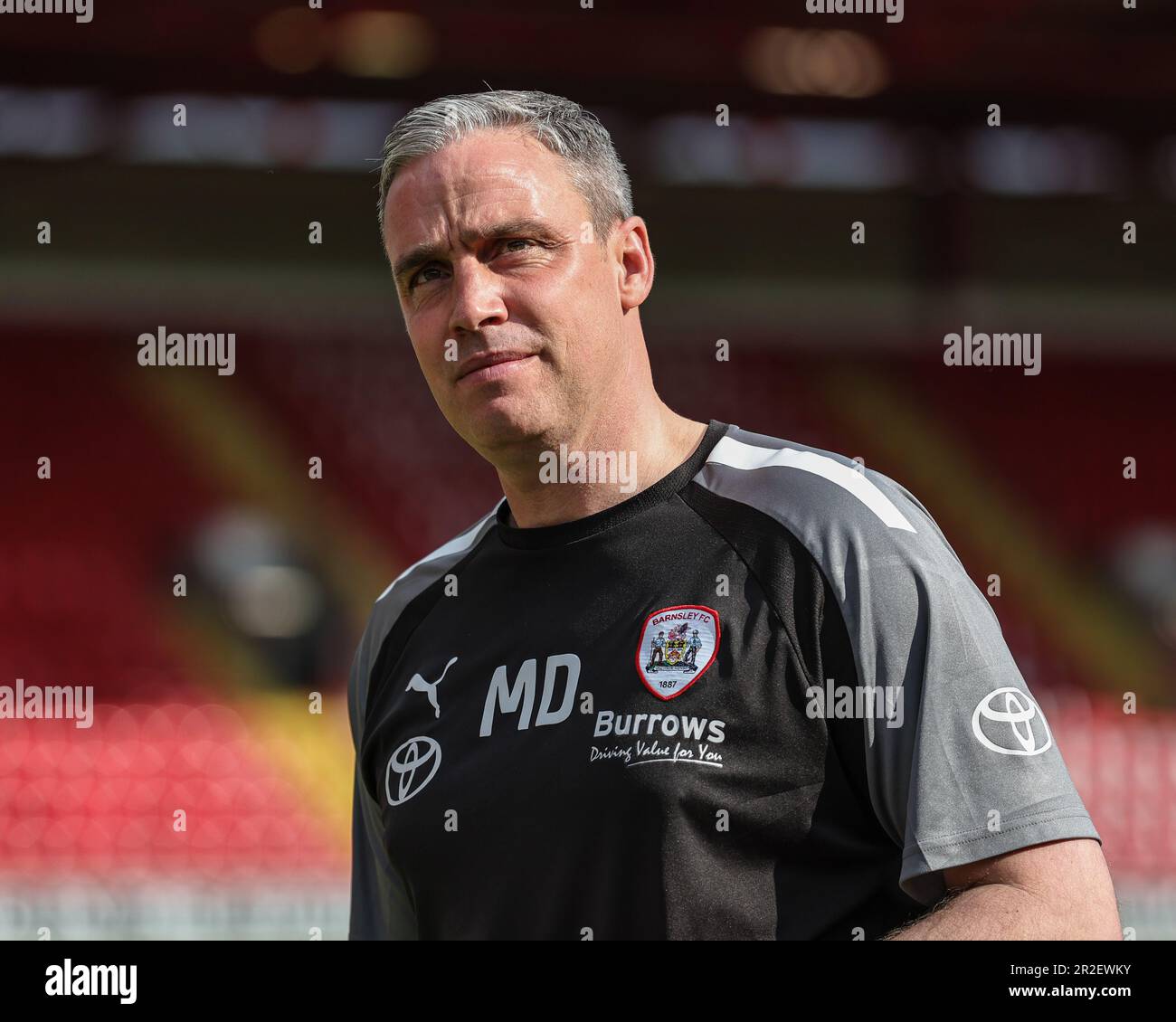 Michael Duff manager of Barnsley walks out to inspect the pitch head of ...