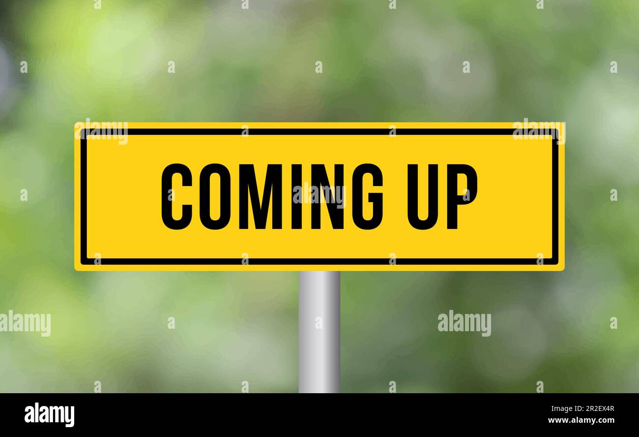 Coming up road sign on blur background Stock Photo - Alamy