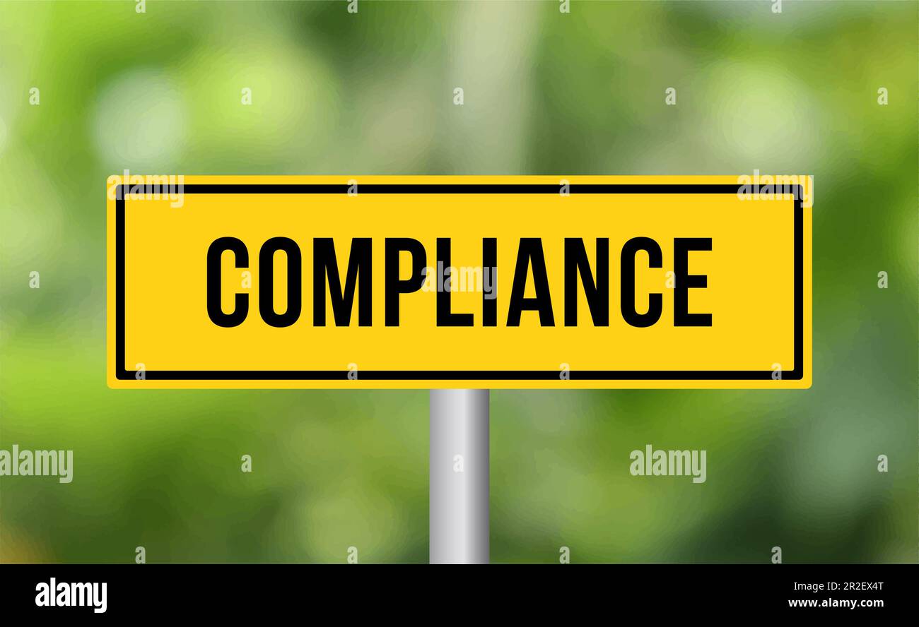 Compliance road sign on blur background Stock Photo - Alamy