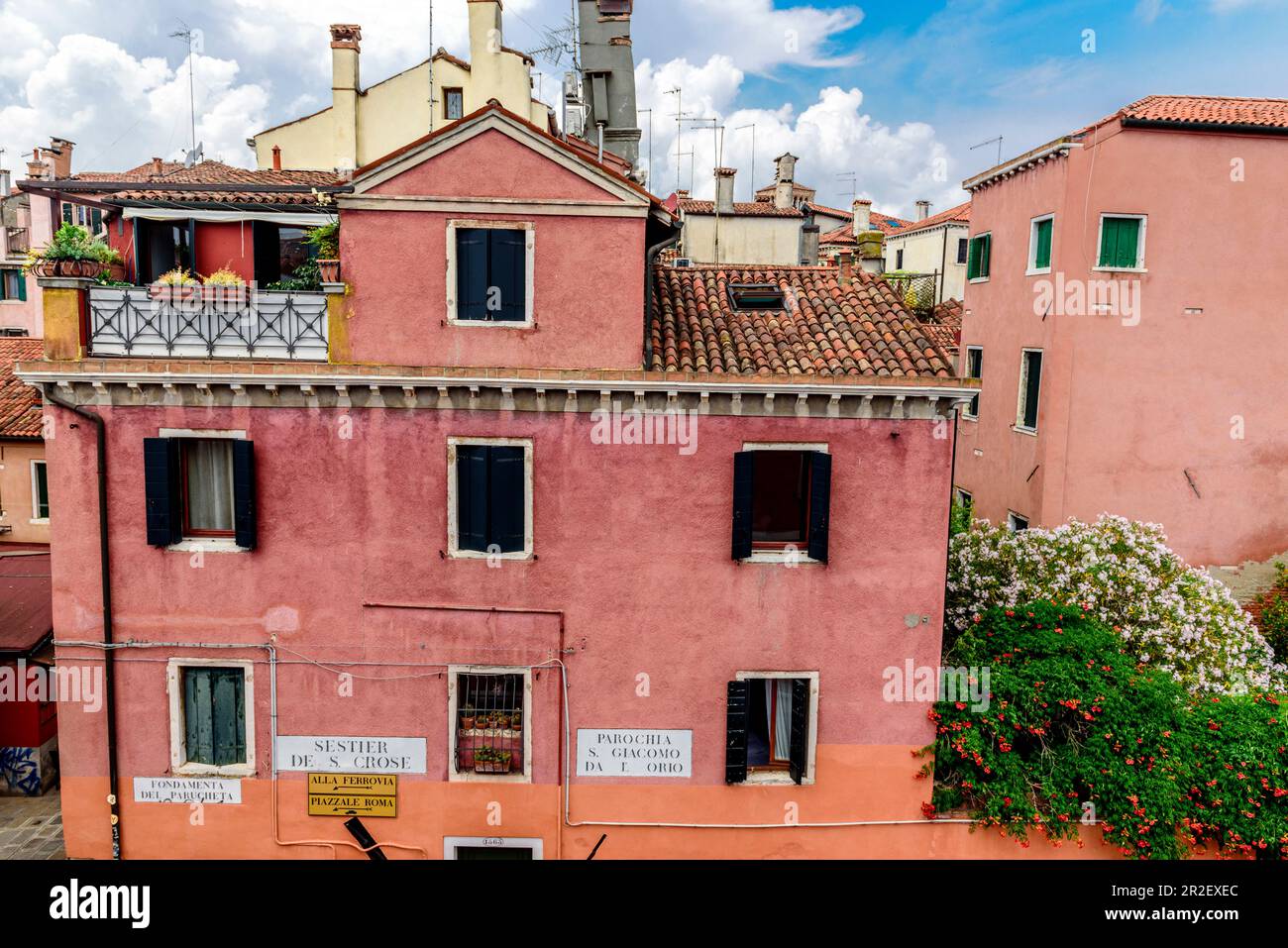 House with red facade, Venice, Italy Stock Photo - Alamy