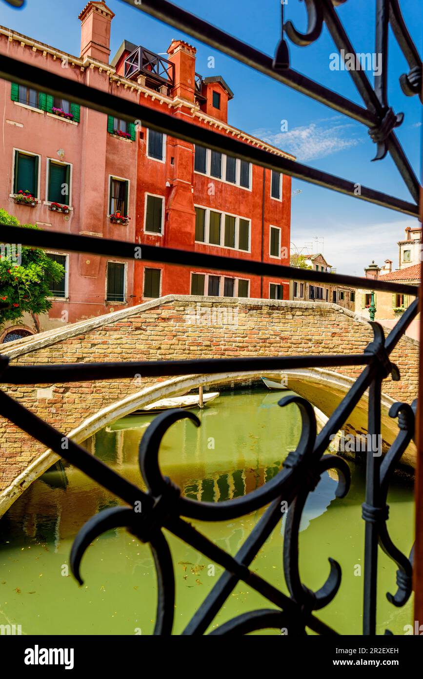 View through window grille on canal, Venice, Italy Stock Photo - Alamy