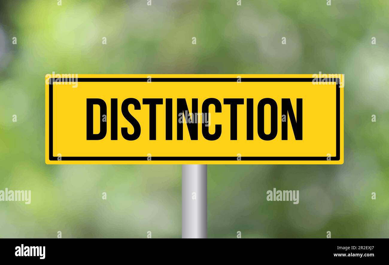 Distinction road sign on blur background Stock Photo - Alamy