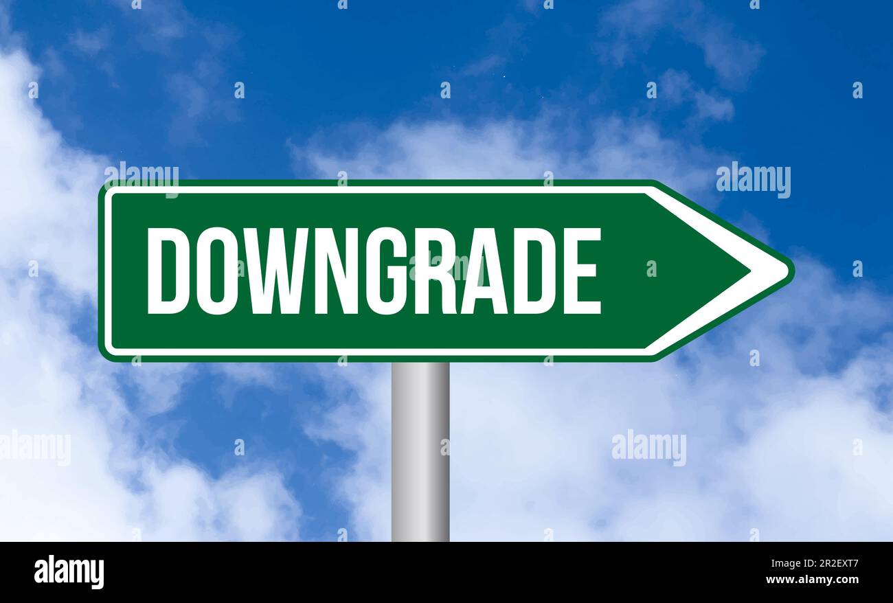 Downgrade road sign on sky background Stock Photo - Alamy