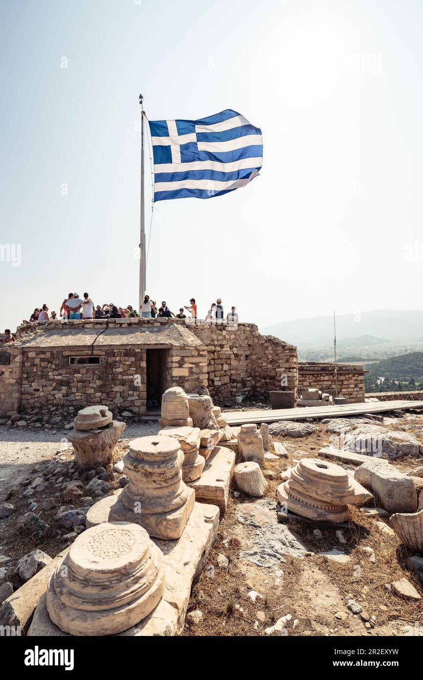 Visitors under the Greek flag on the Acropolis, Athens, Greece Stock ...
