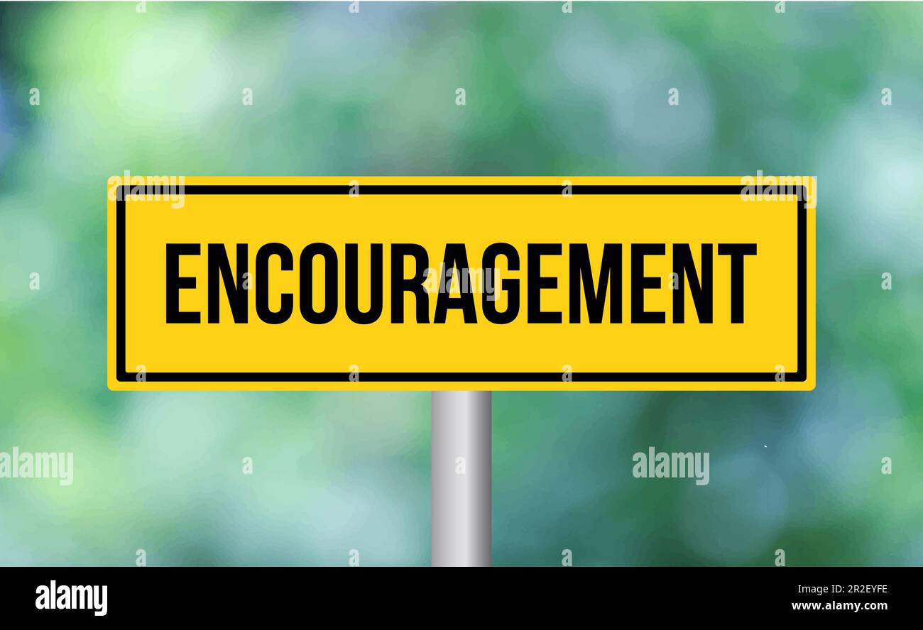Encouragement road sign on blur background Stock Photo - Alamy