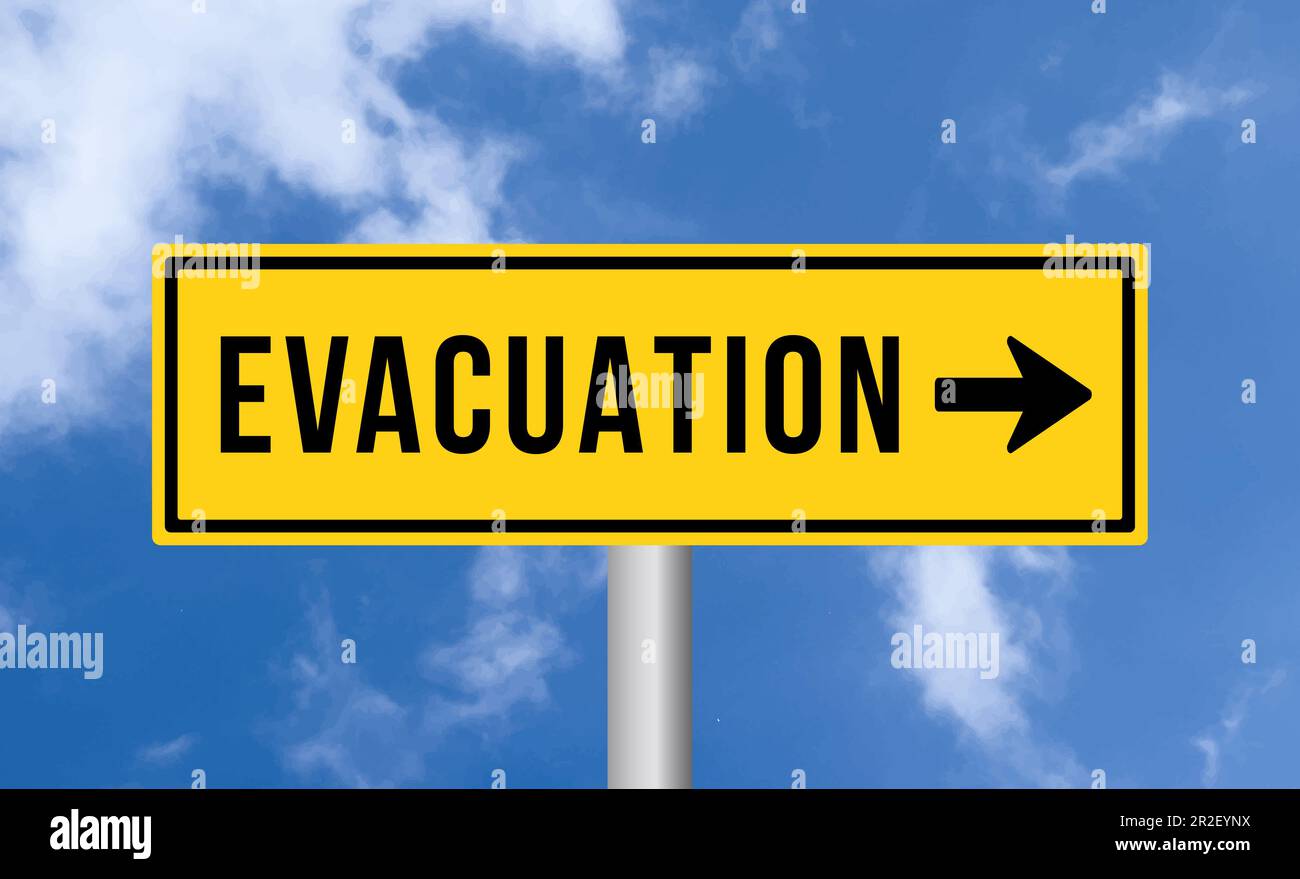 Evacuation road sign on blue sky background Stock Photo - Alamy