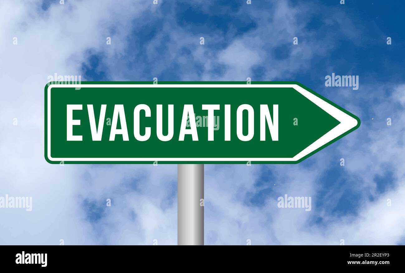 Evacuation road sign on blue sky background Stock Photo - Alamy