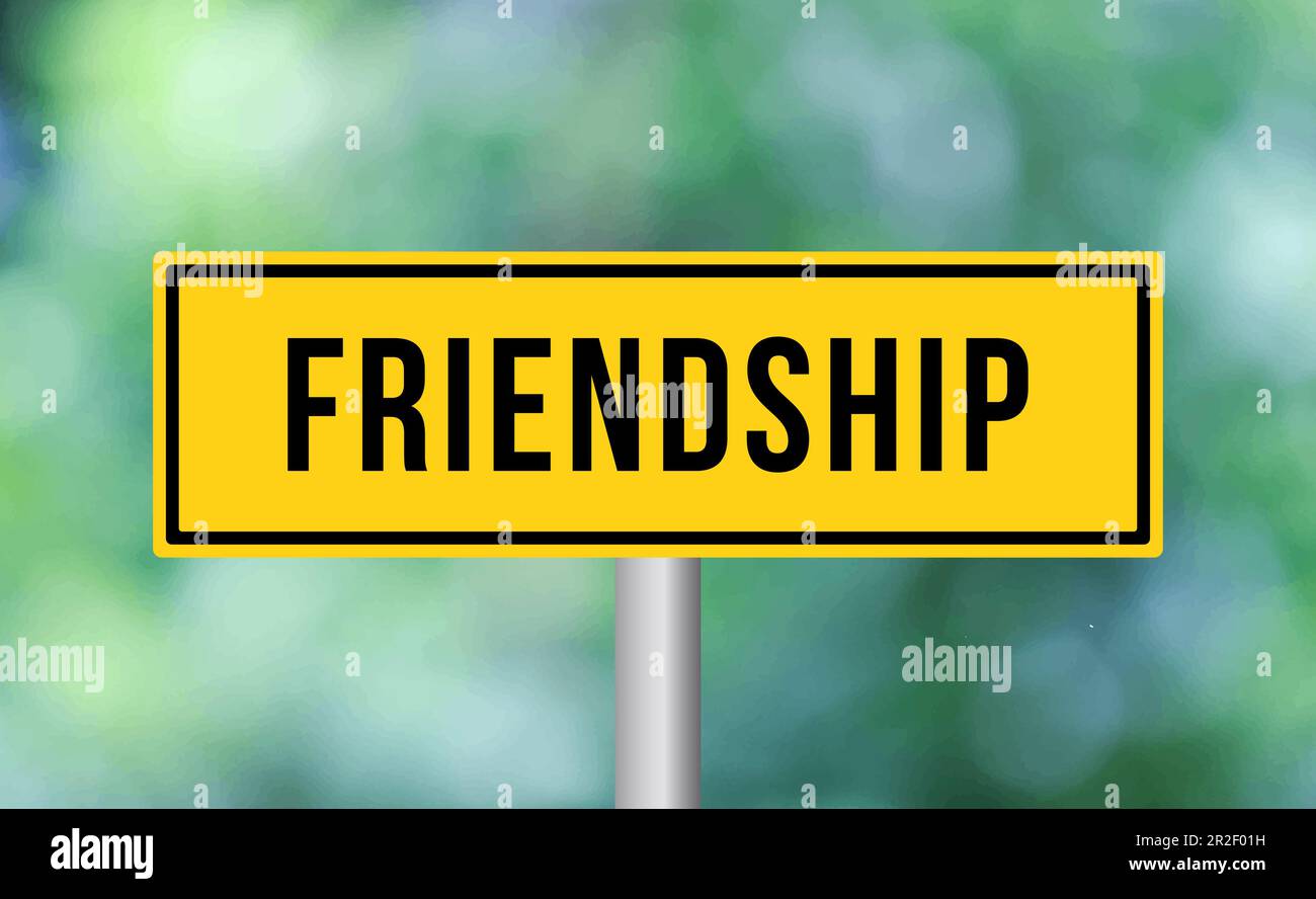 Friendship road sign on blur background Stock Photo - Alamy