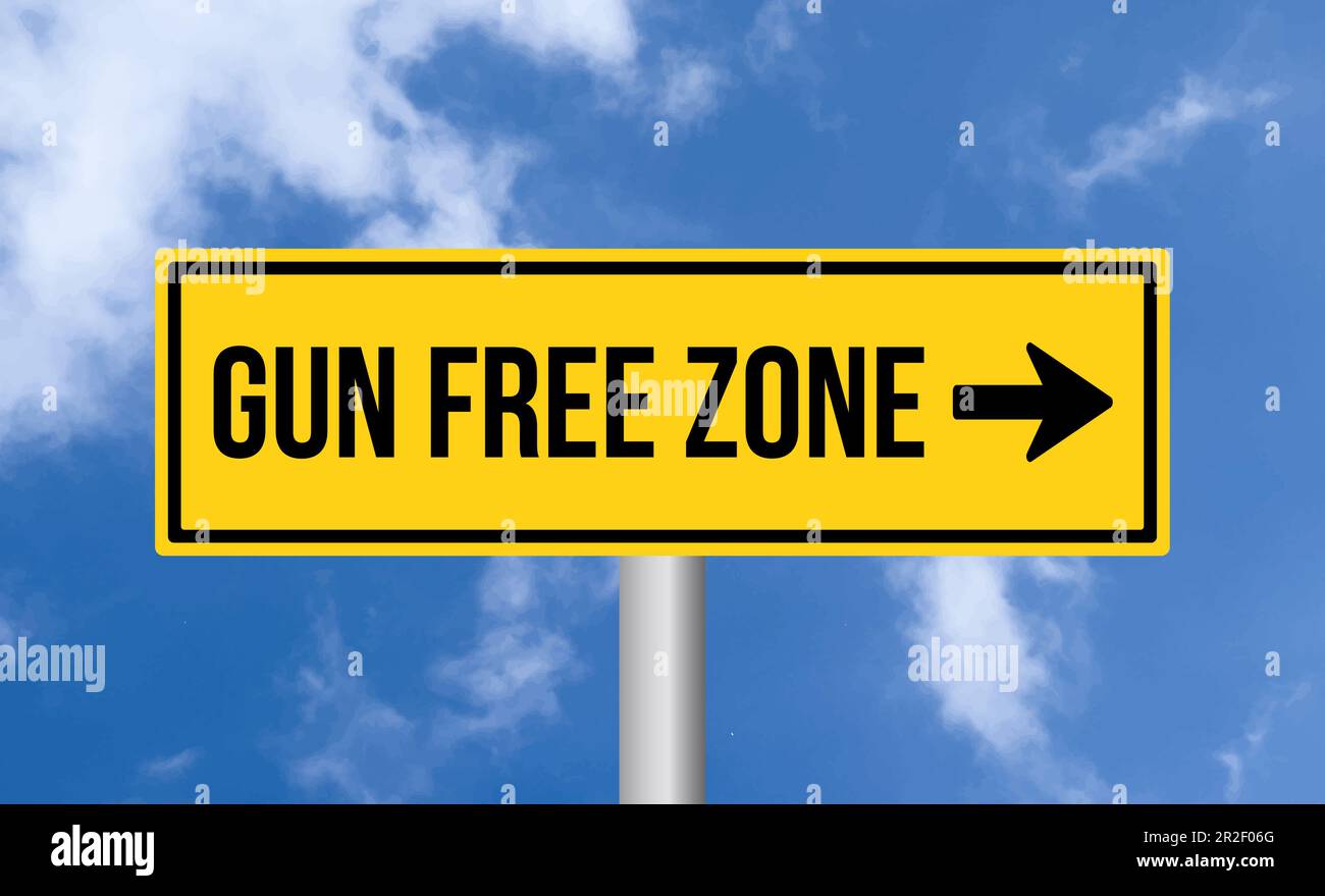 Gun free zone road sign on sky background Stock Photo - Alamy