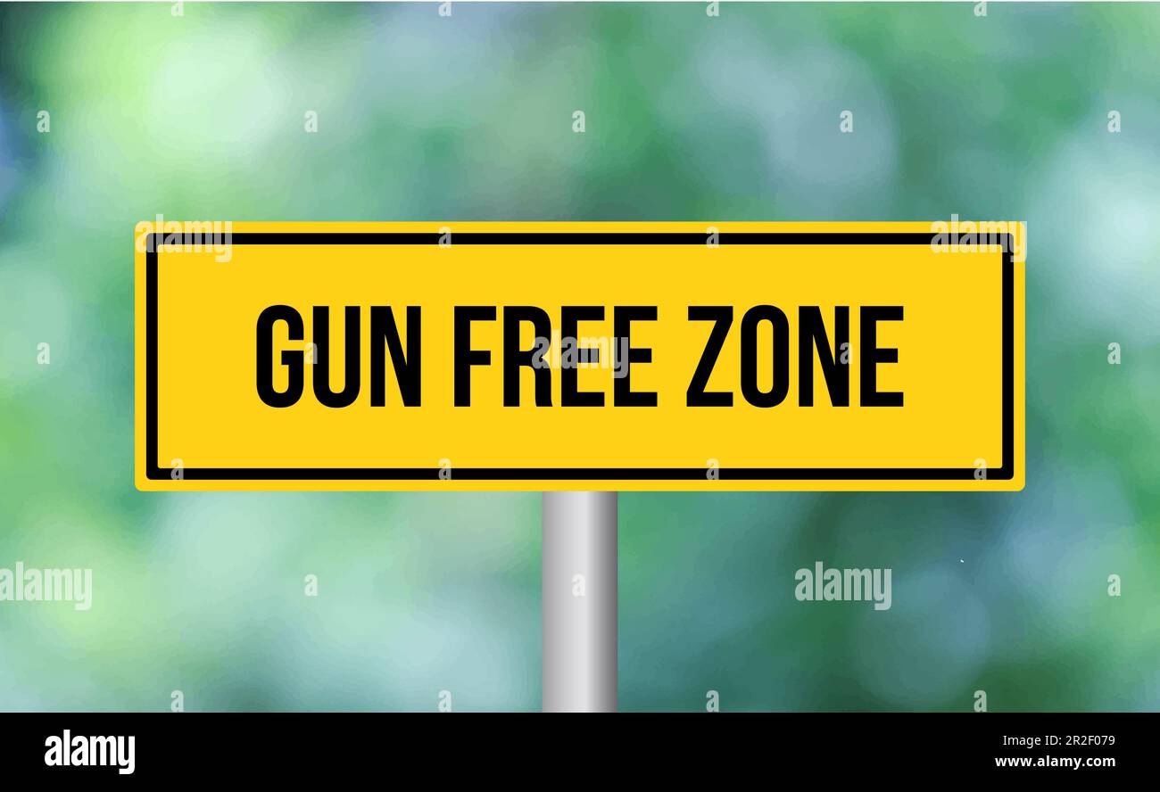 Gun free zone road sign on blur background Stock Photo - Alamy