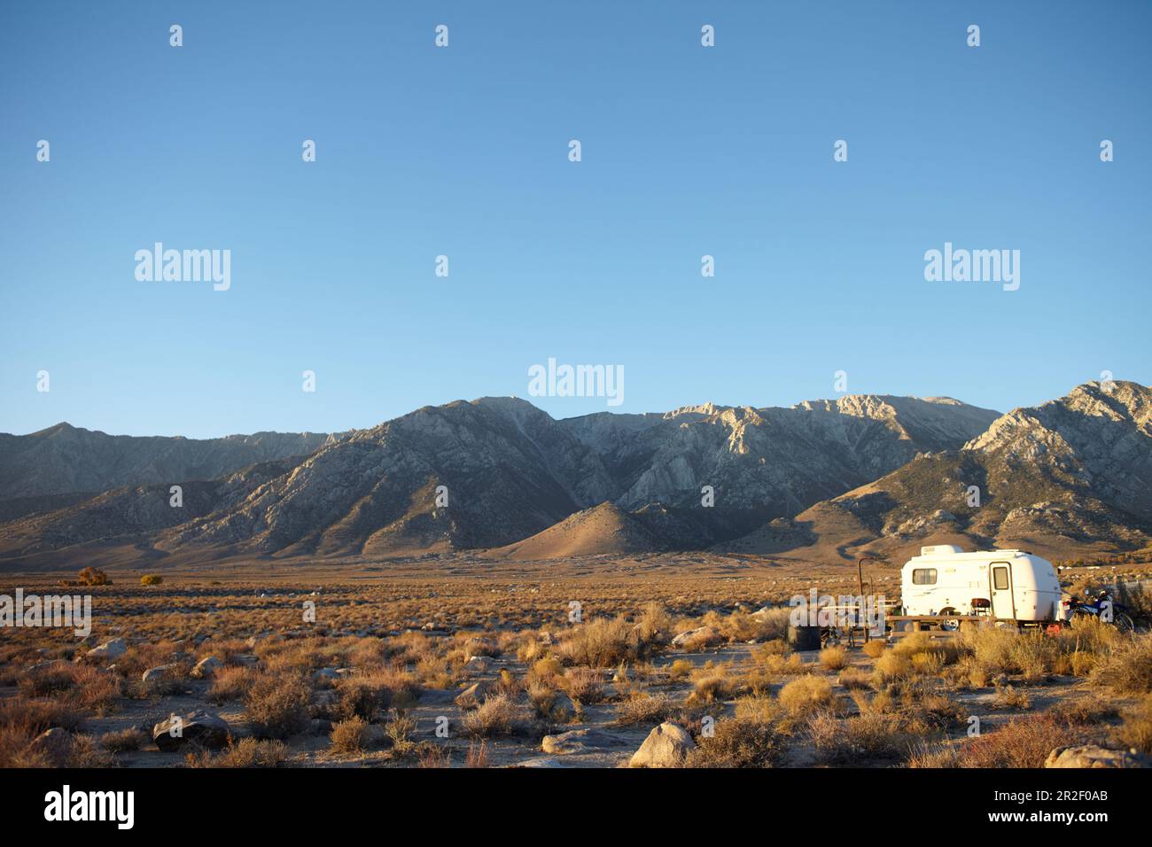 Caravan in steppe landscape in front of the White Mountains, Eastern ...