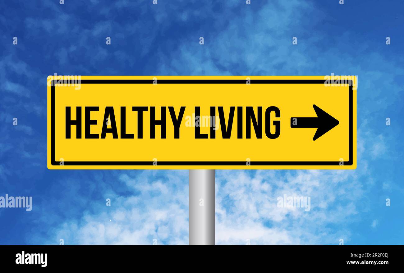 Healthy living road sign on sky background Stock Photo - Alamy