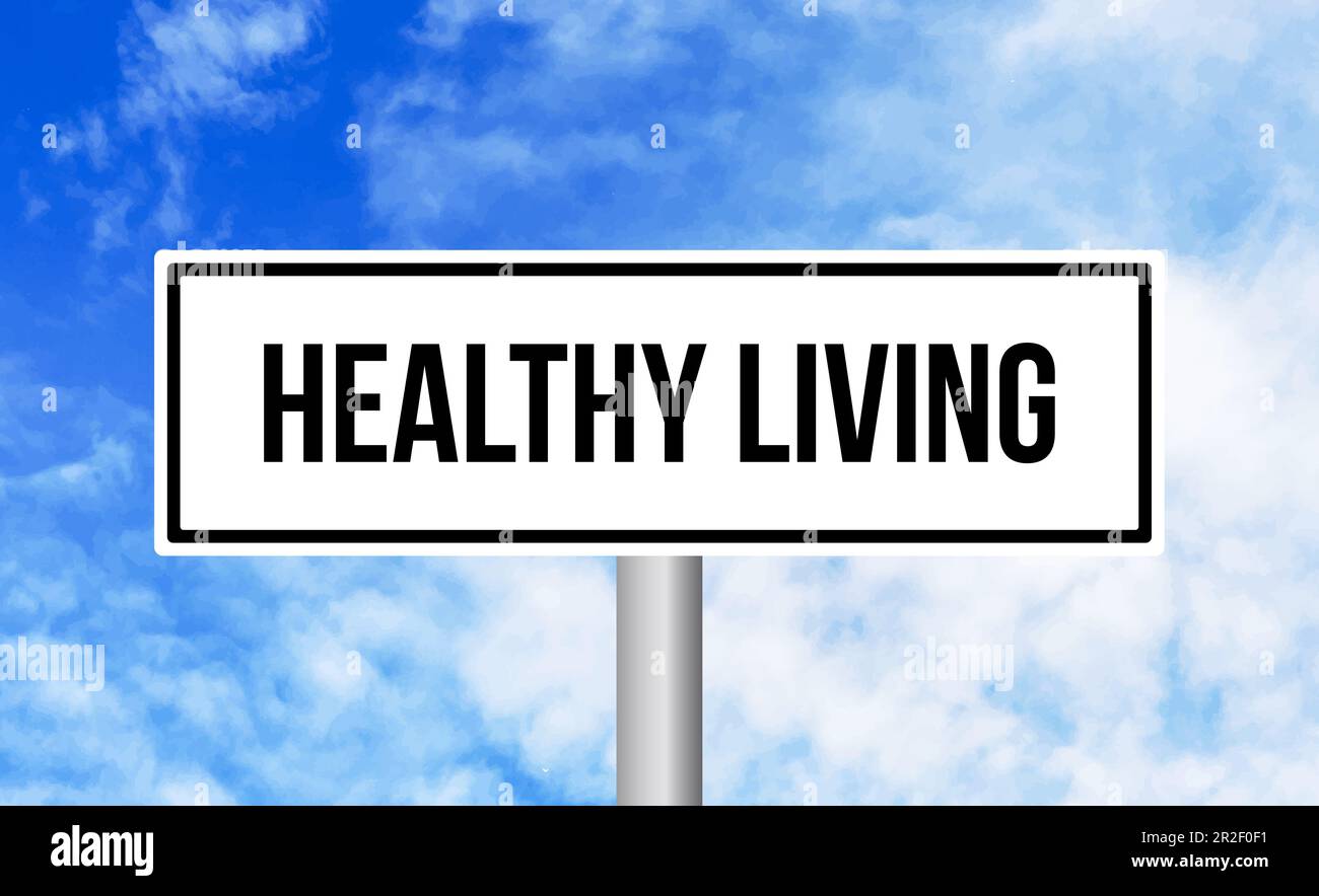 Healthy living road sign on sky background Stock Photo - Alamy