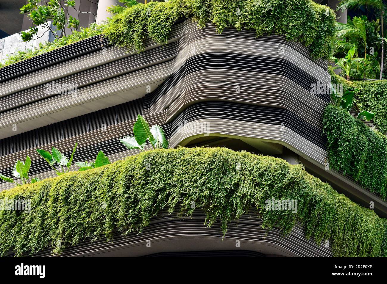 Facade greenery and unusual architecture of a skyscraper in Singapore ...