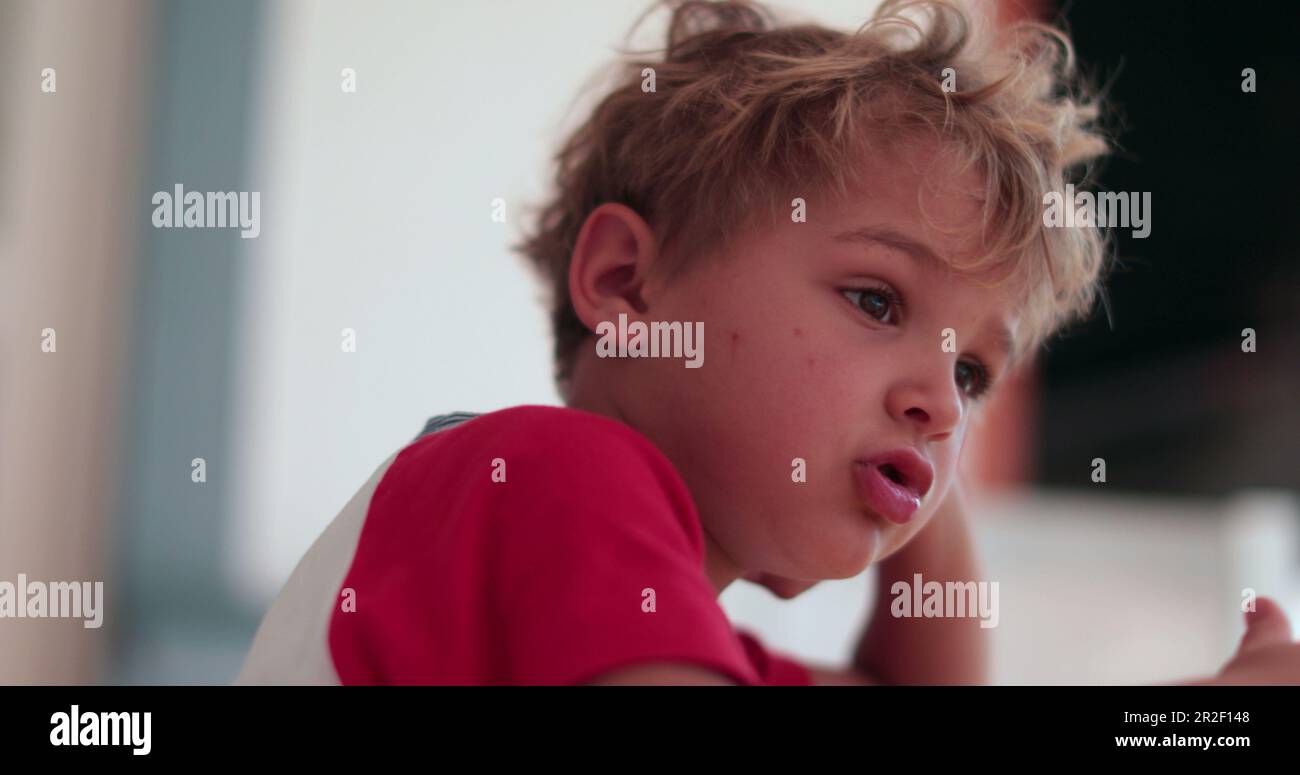 Contemplative toddler kid face thinking. Bored child boy lost in ...