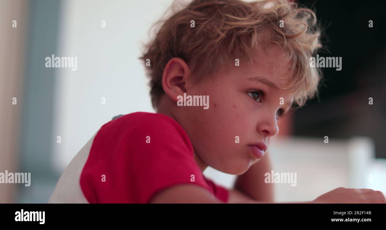 Contemplative toddler kid face thinking. Bored child boy lost in ...