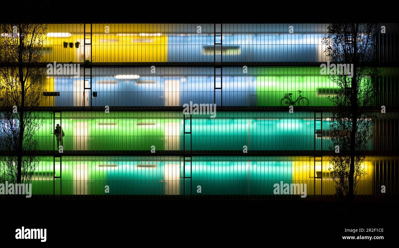 Colorfully illuminated residential building at night, Munich Stock ...