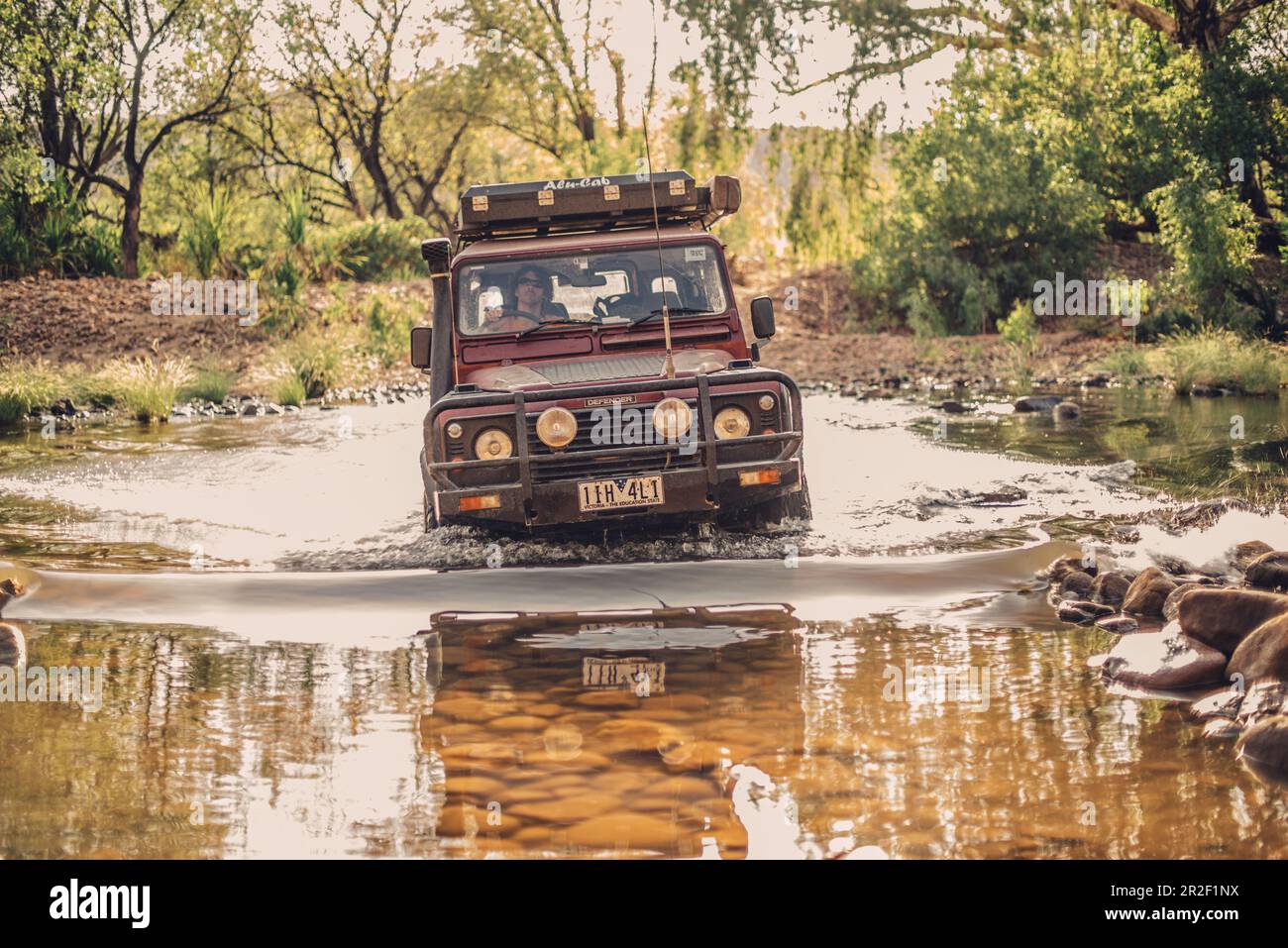 Off-road vehicle crosses river in El Questro Wilderness Park, Kimberley ...