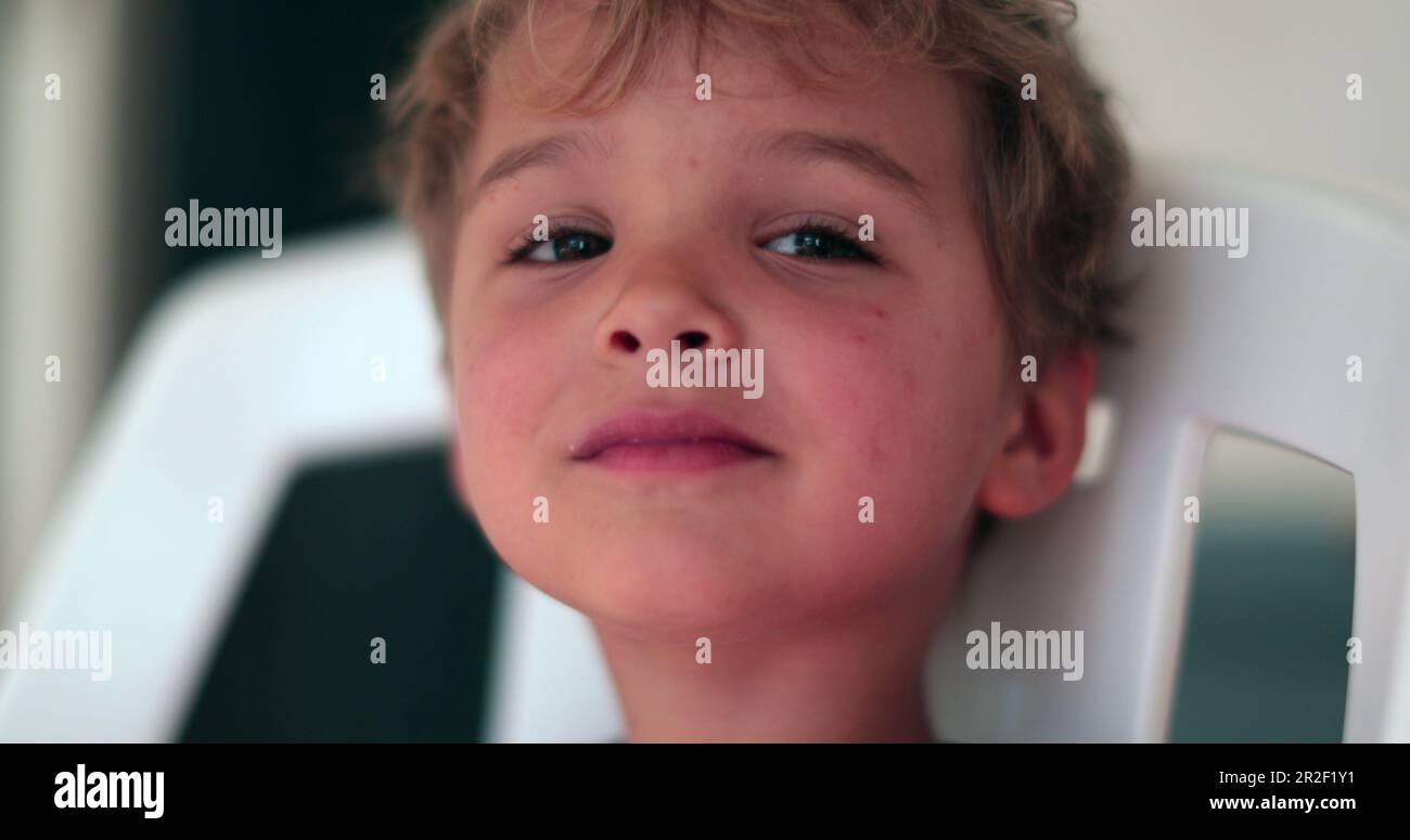 Little blonde boy waving his head and saying no. Kid shaking head in ...