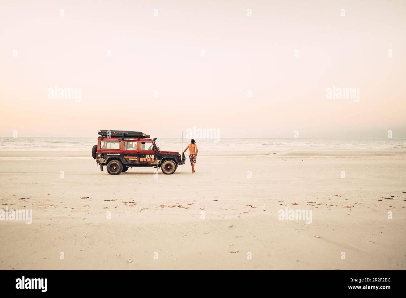 Sunset with SUVs at 80 Mile Beach in Western Australia, Australia ...