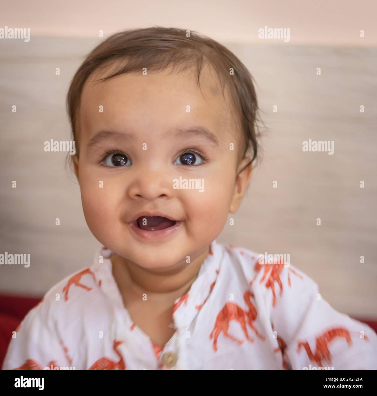 cute infant isolated smiling face from flat angle Stock Photo - Alamy