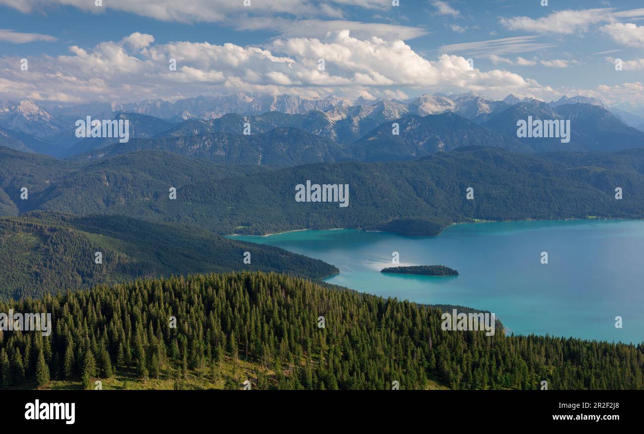 Turquoise Walchensee with Sassau island, forest, mountains and clouds ...