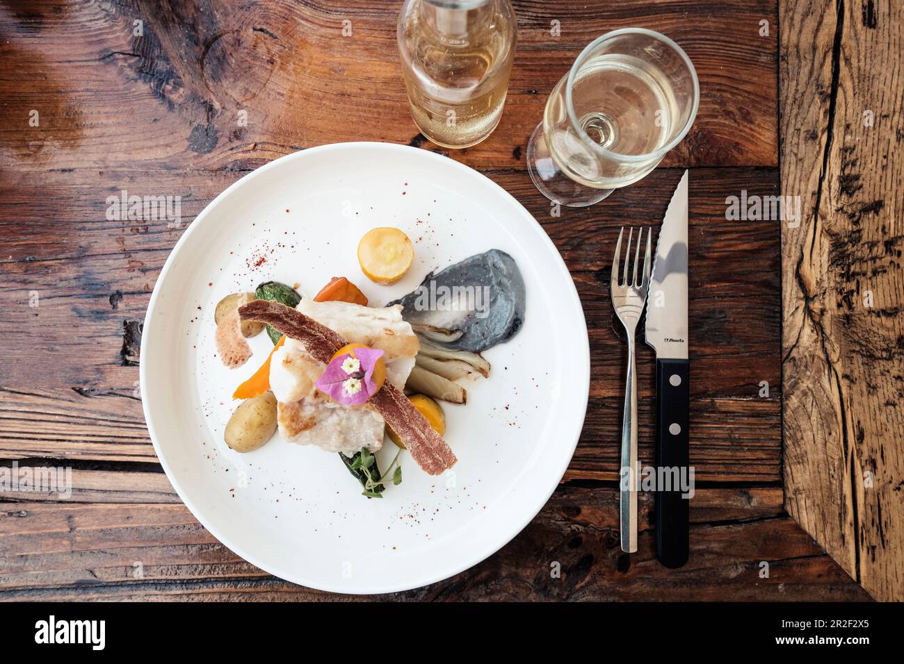 Local fish dish: Julienne with potatoes, yellow and green zucchini ...