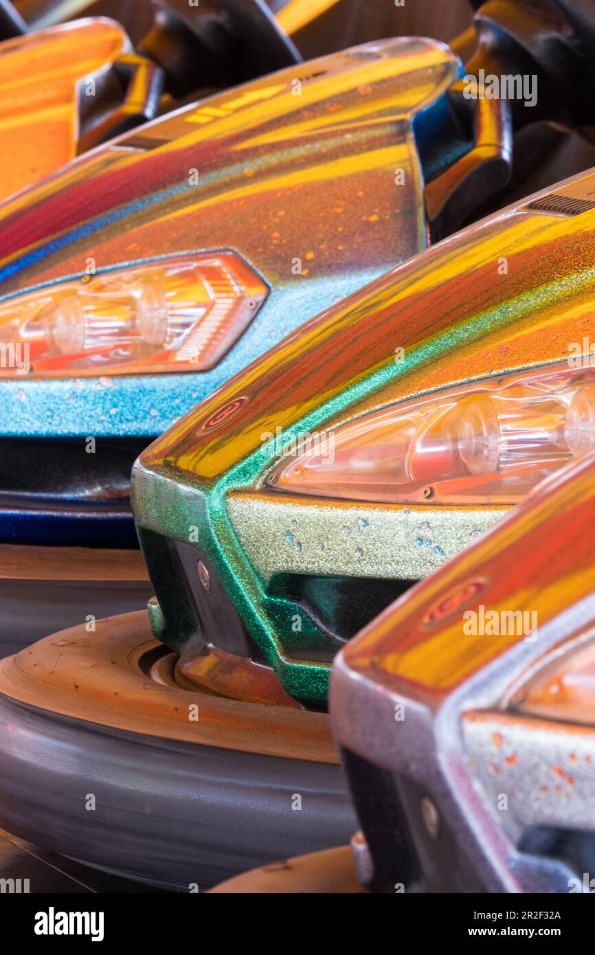Brightly coloured bumper cars at the funfair Stock Photo - Alamy