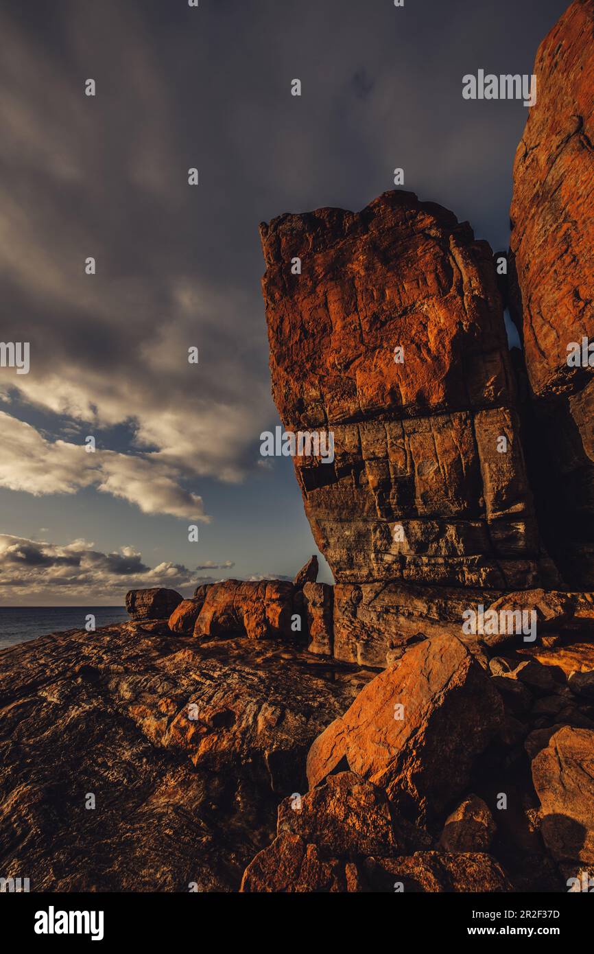 Reddish red river rocks hi-res stock photography and images - Alamy